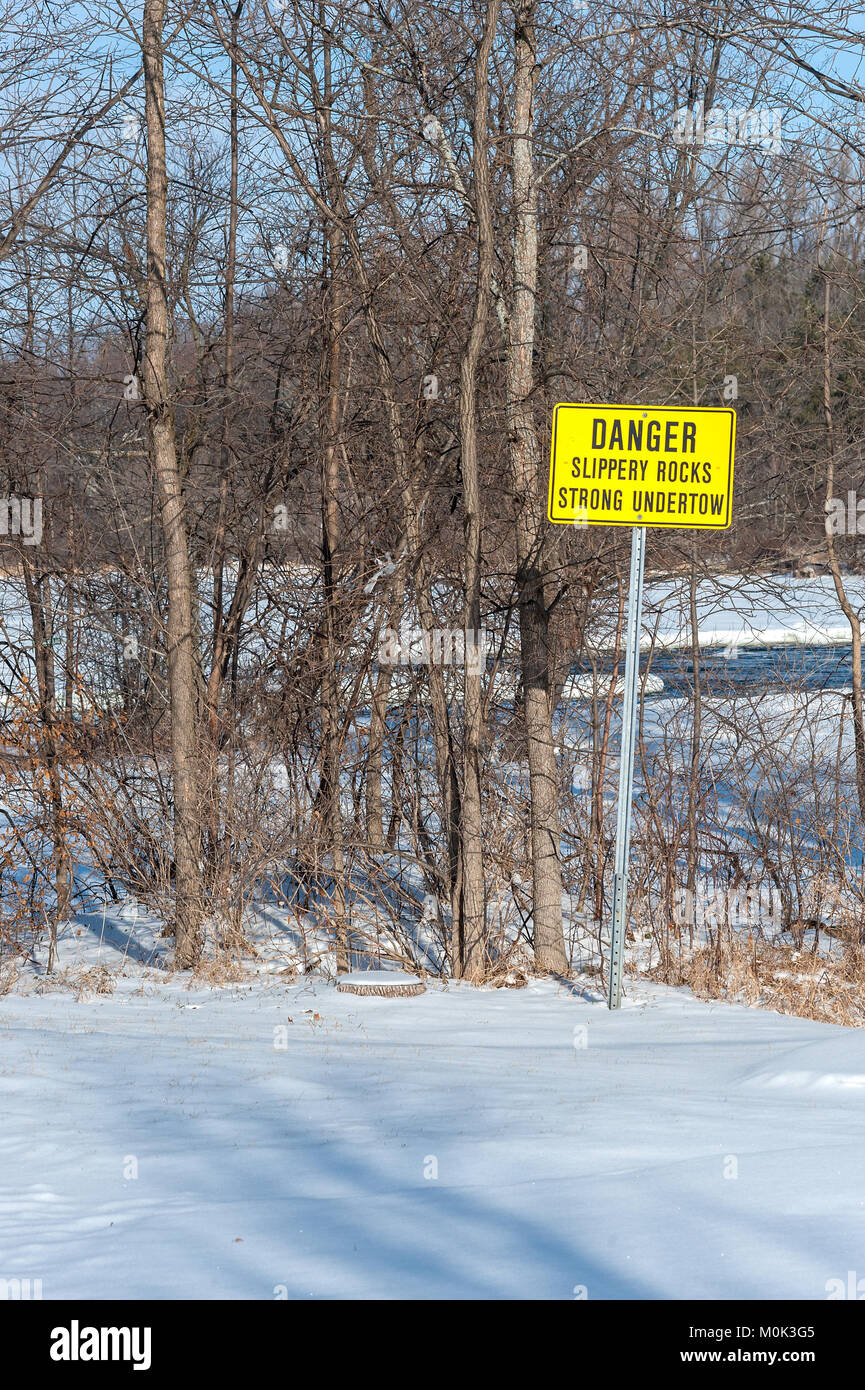 Danger sign at river's edge in winter Stock Photo - Alamy