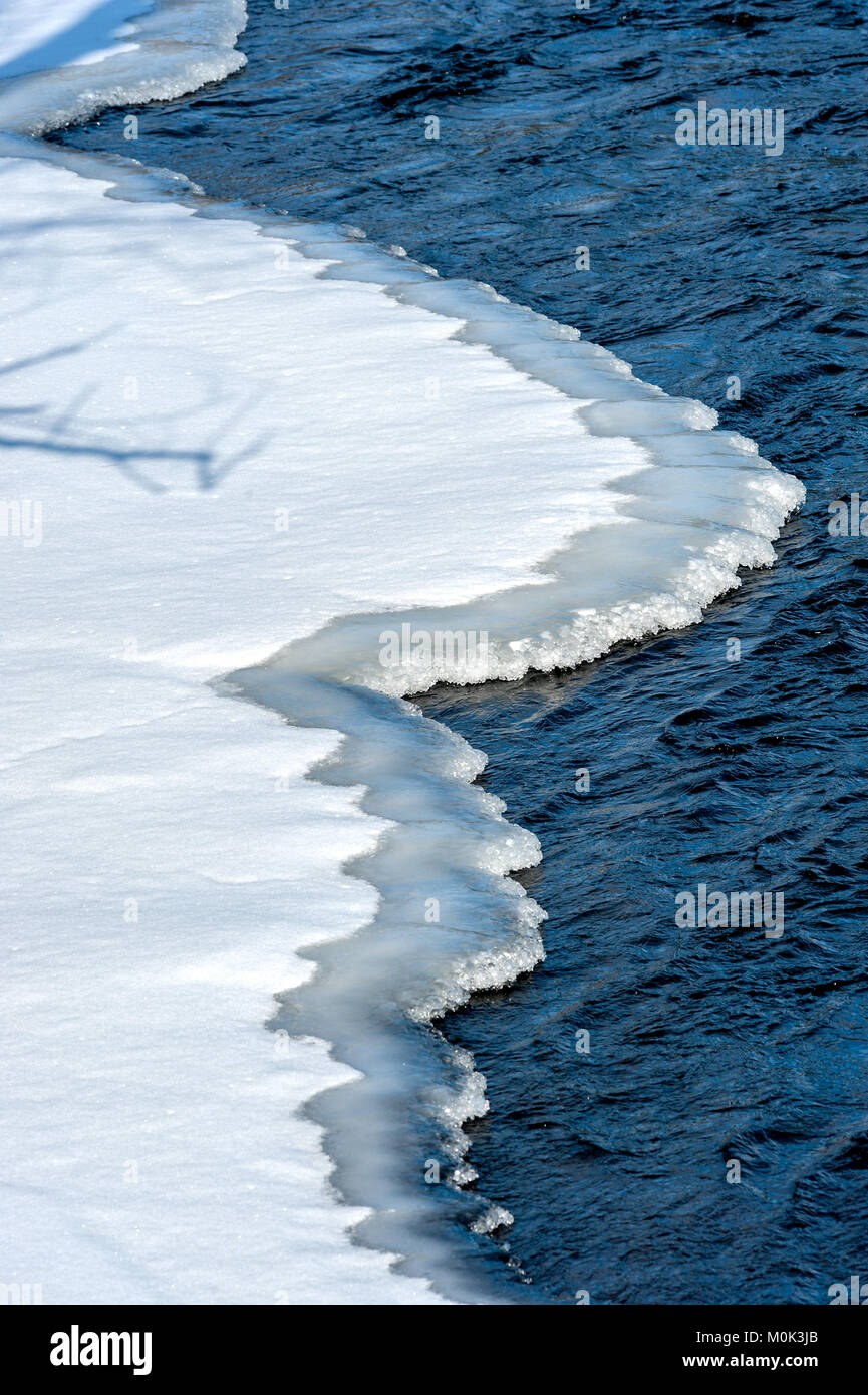 edge of the ice by flowing water Stock Photo - Alamy