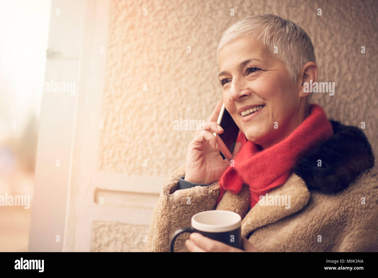 Happy senior woman having a pleasant phone call Stock Photo - Alamy