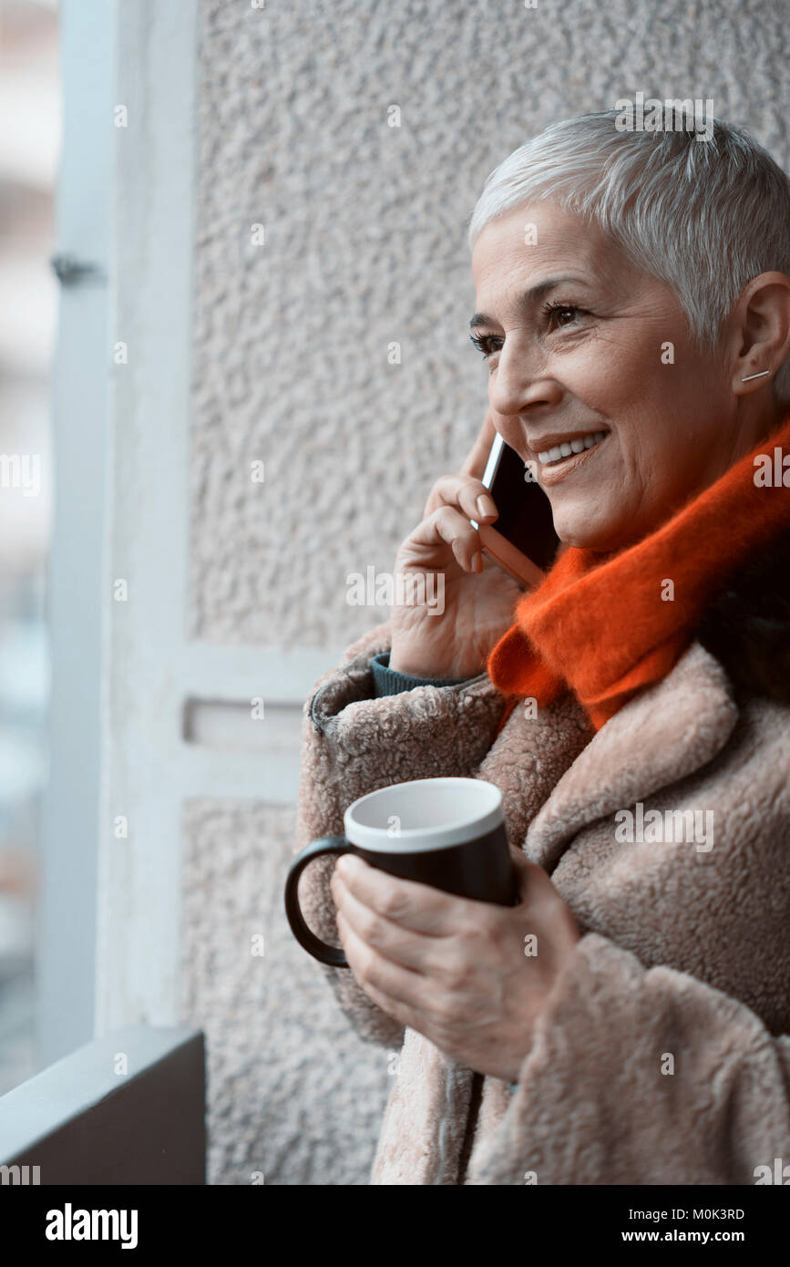 Happy senior woman having a pleasant phone call Stock Photo - Alamy
