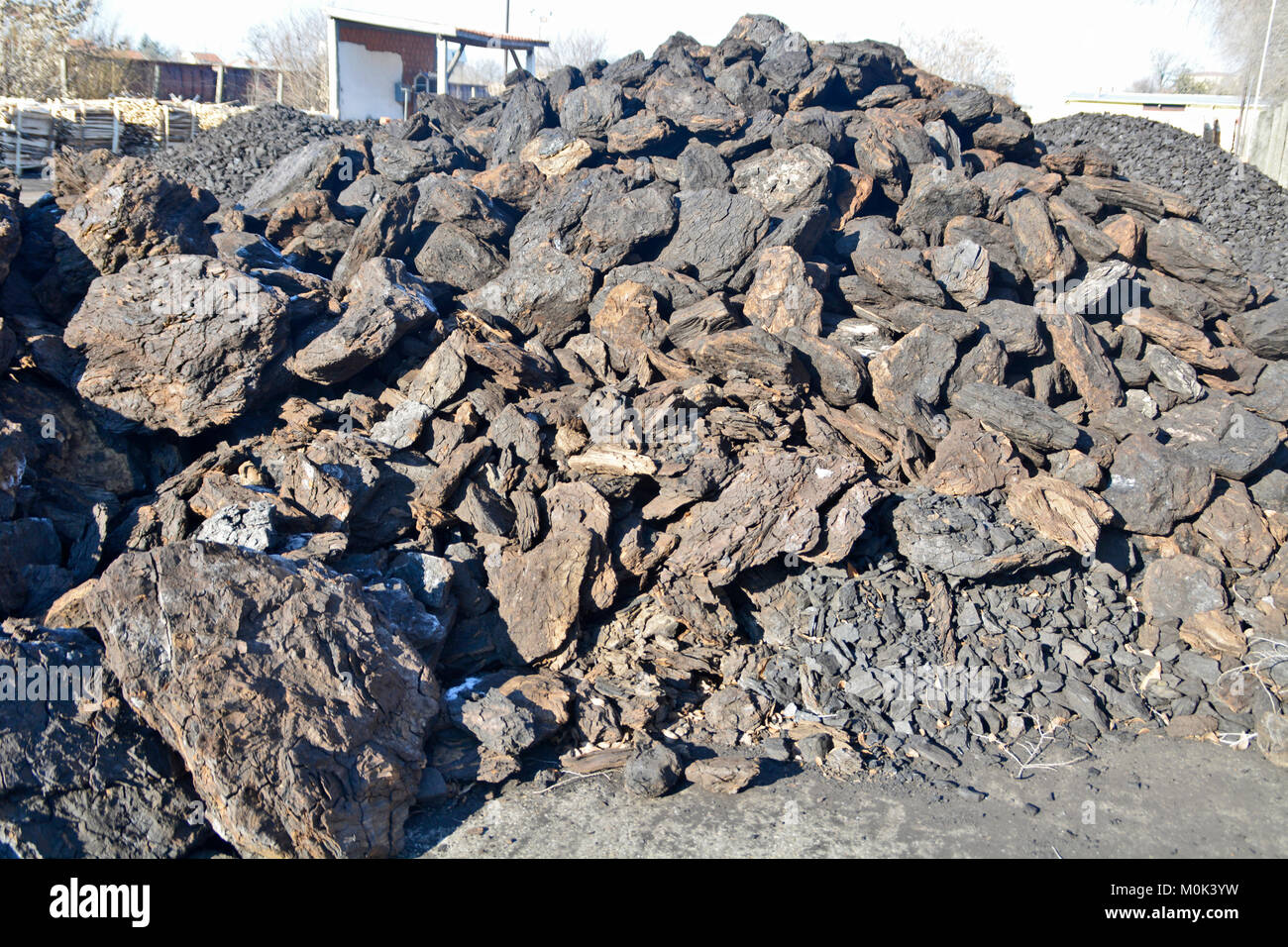 Coal in the outer warehouse is waiting for purchase and transportation ...