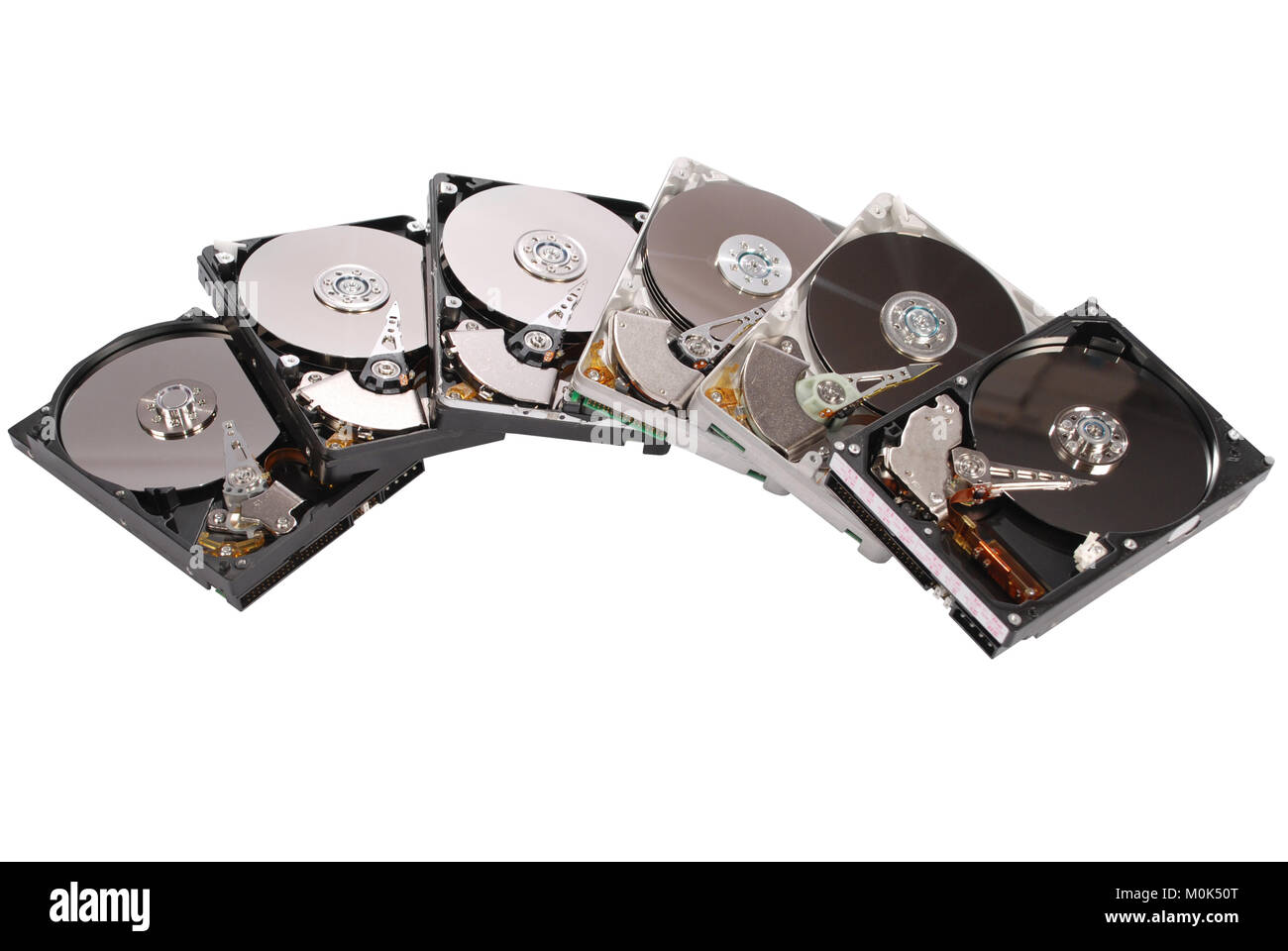 Many Open Hard drives isolated on white background. Are combined by a ...