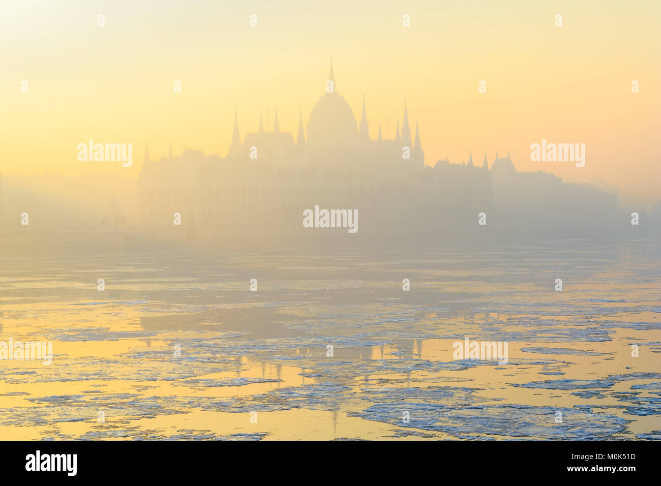 Budapest Parliament building outline in yellow winter haze across ...