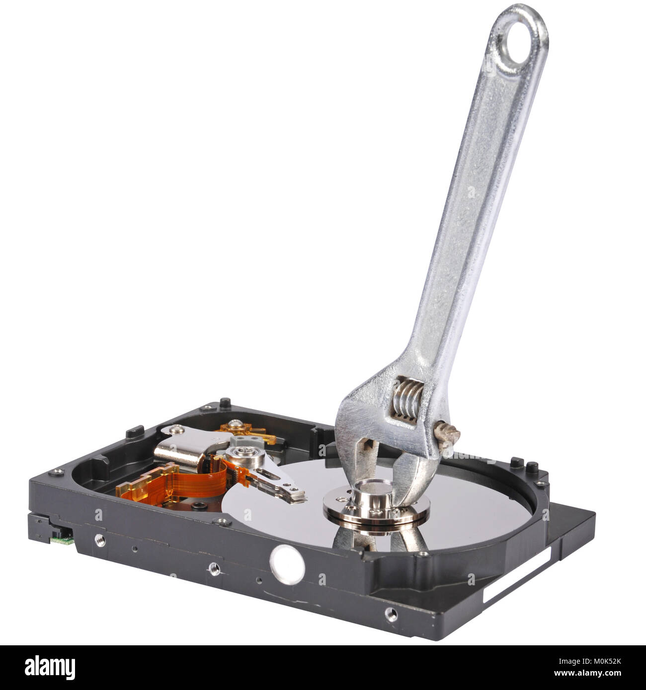 Adjustable wrench turn off a hard disk. On a white background Stock ...