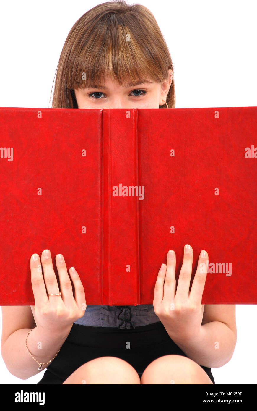 Girl has hidden for the open book on white background Stock Photo - Alamy