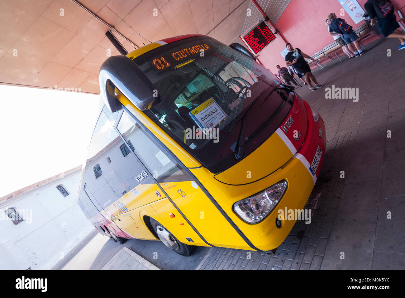 A public transport bus at the bus station in Mahon , Menorca , Balearic ...
