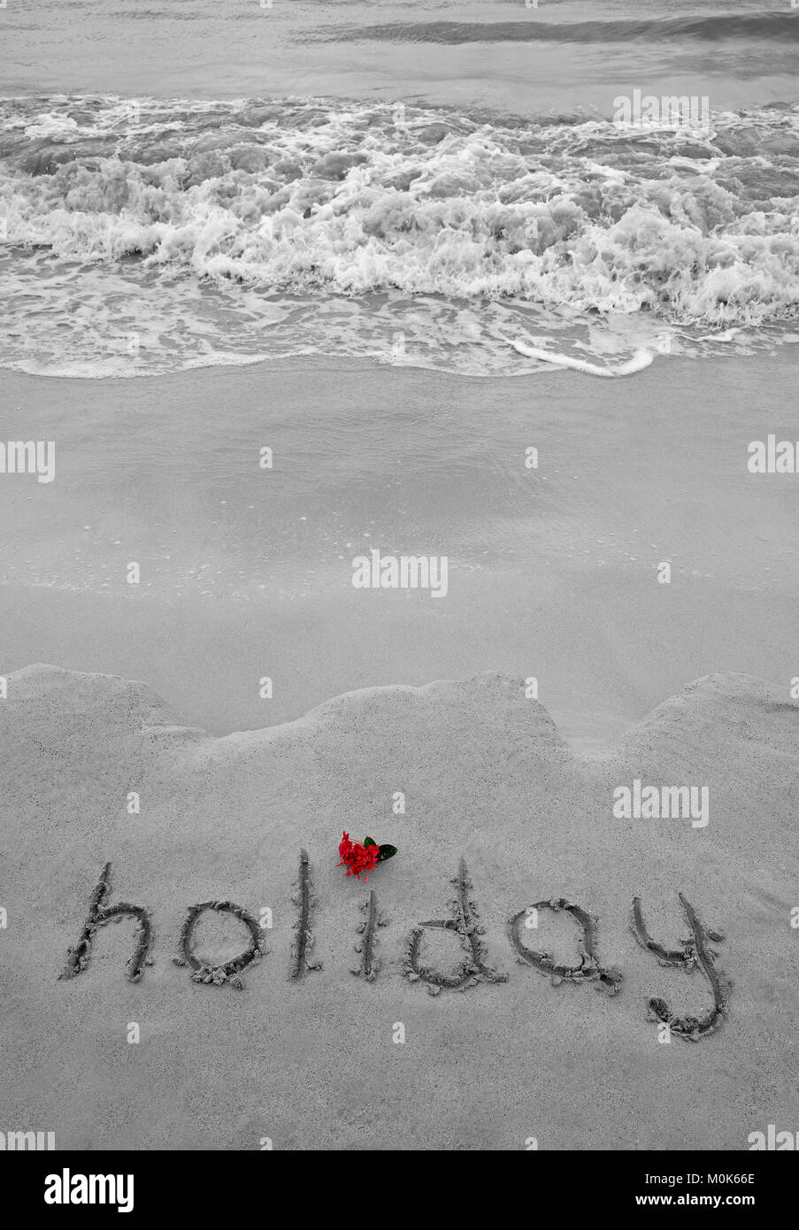 The word holiday written on the sand by the ocean Stock Photo - Alamy