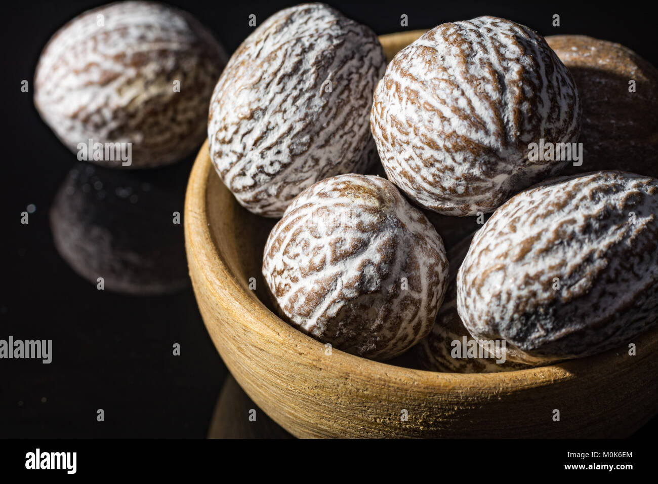 Macro collection, dried muscat nutmeg close up on black background ...