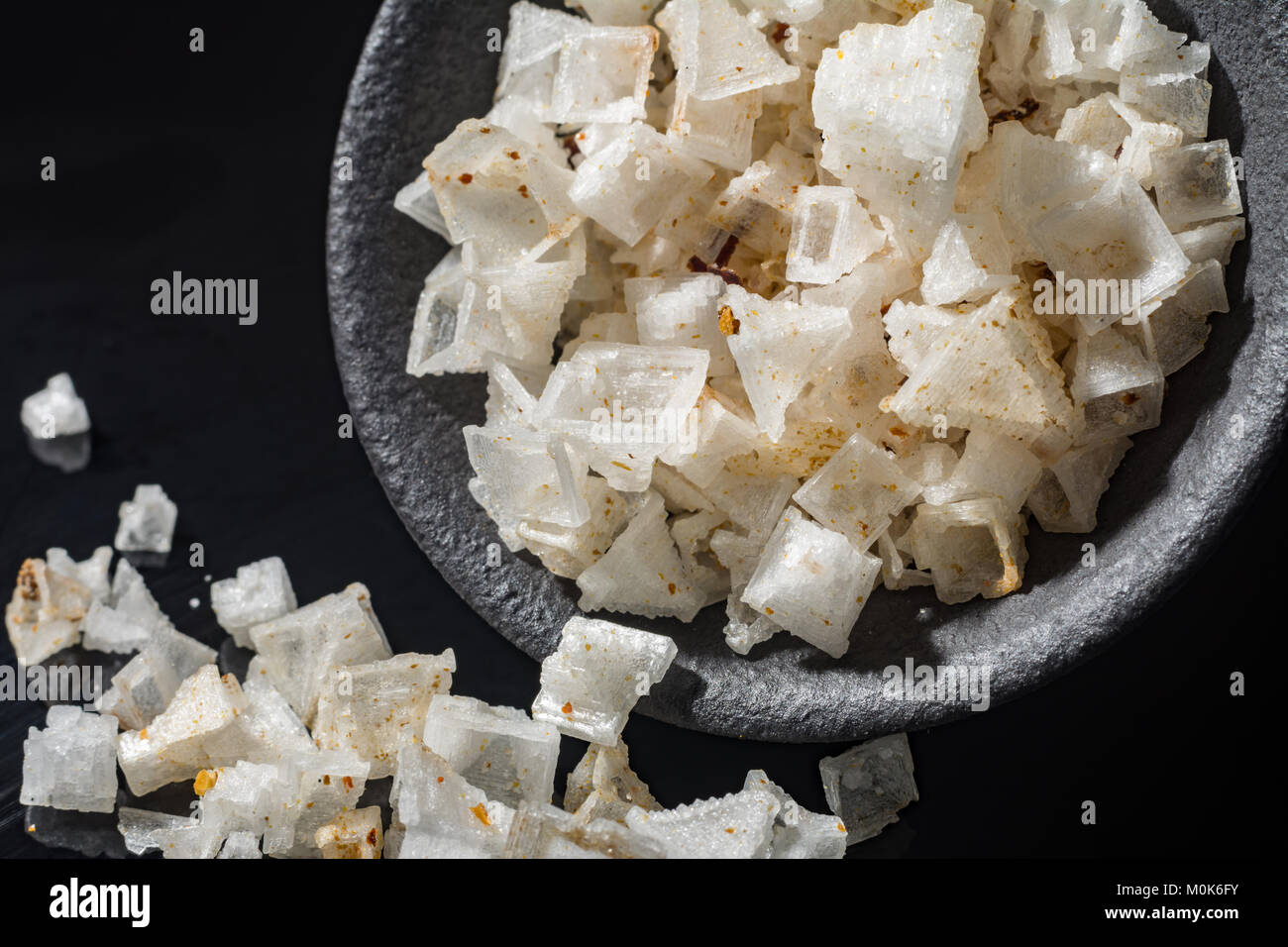 Macro collection, white sea salt pyramide flakes mixed with spices on ...