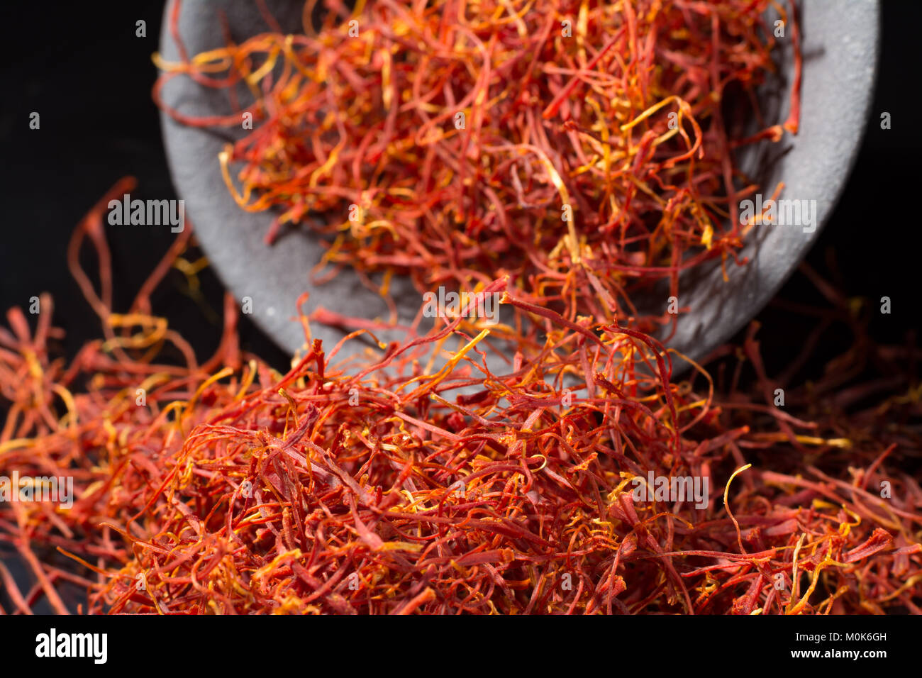 Macro collection, expensive real dried saffron spice close up on black ...