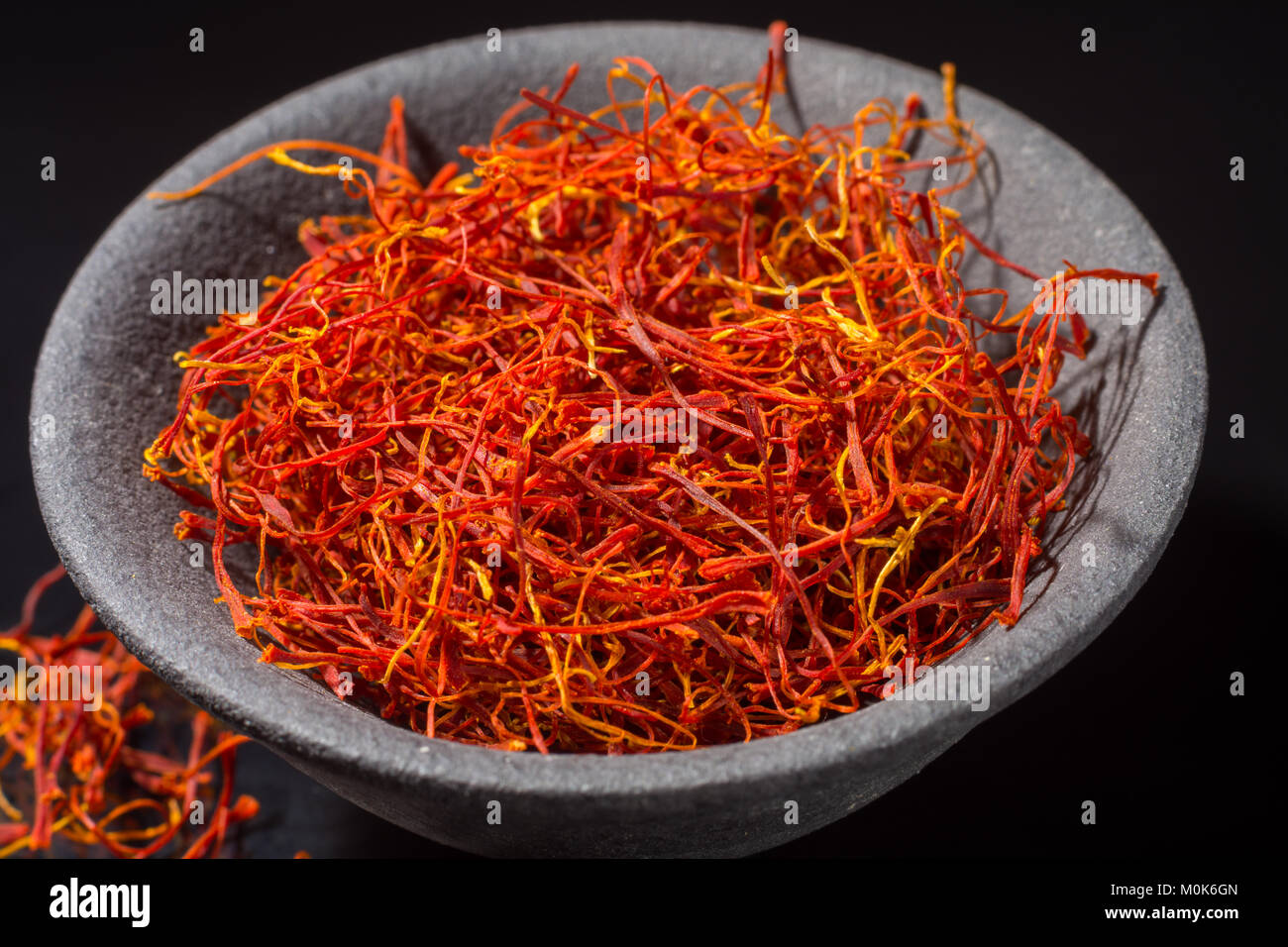 Macro collection, expensive real dried saffron spice close up on black ...