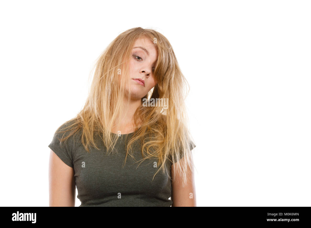 Bad hairstyle concept. Sad blonde woman with messy hair looking tired ...