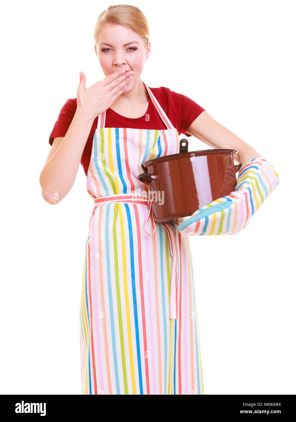 Sleepy tired housewife or chef in colorful kitchen apron with pot of ...