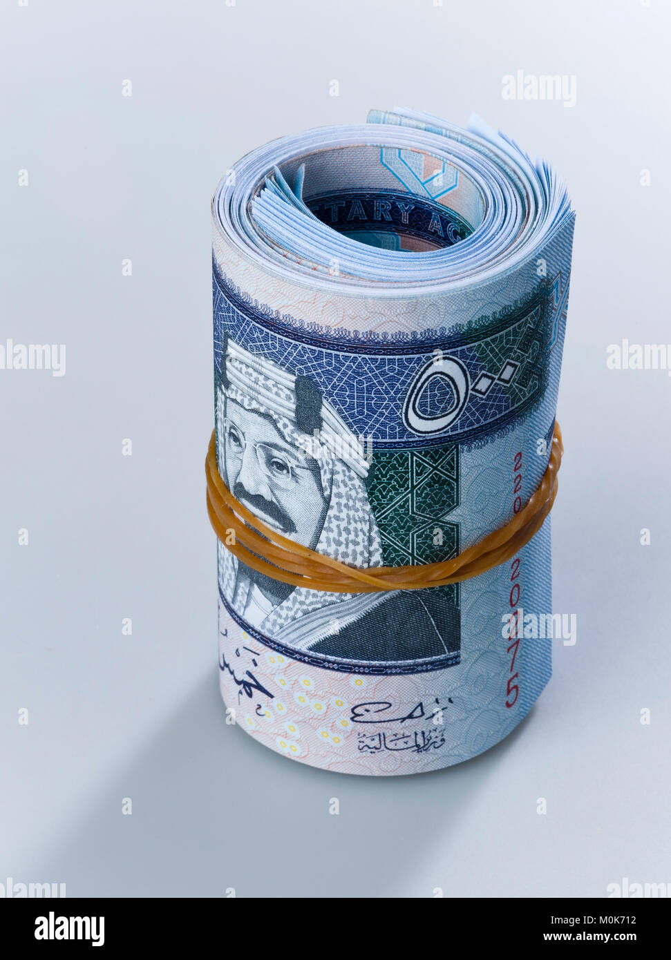 Roll of Saudi Riyal Banknotes of 500 with image of King Abdulaziz close ...