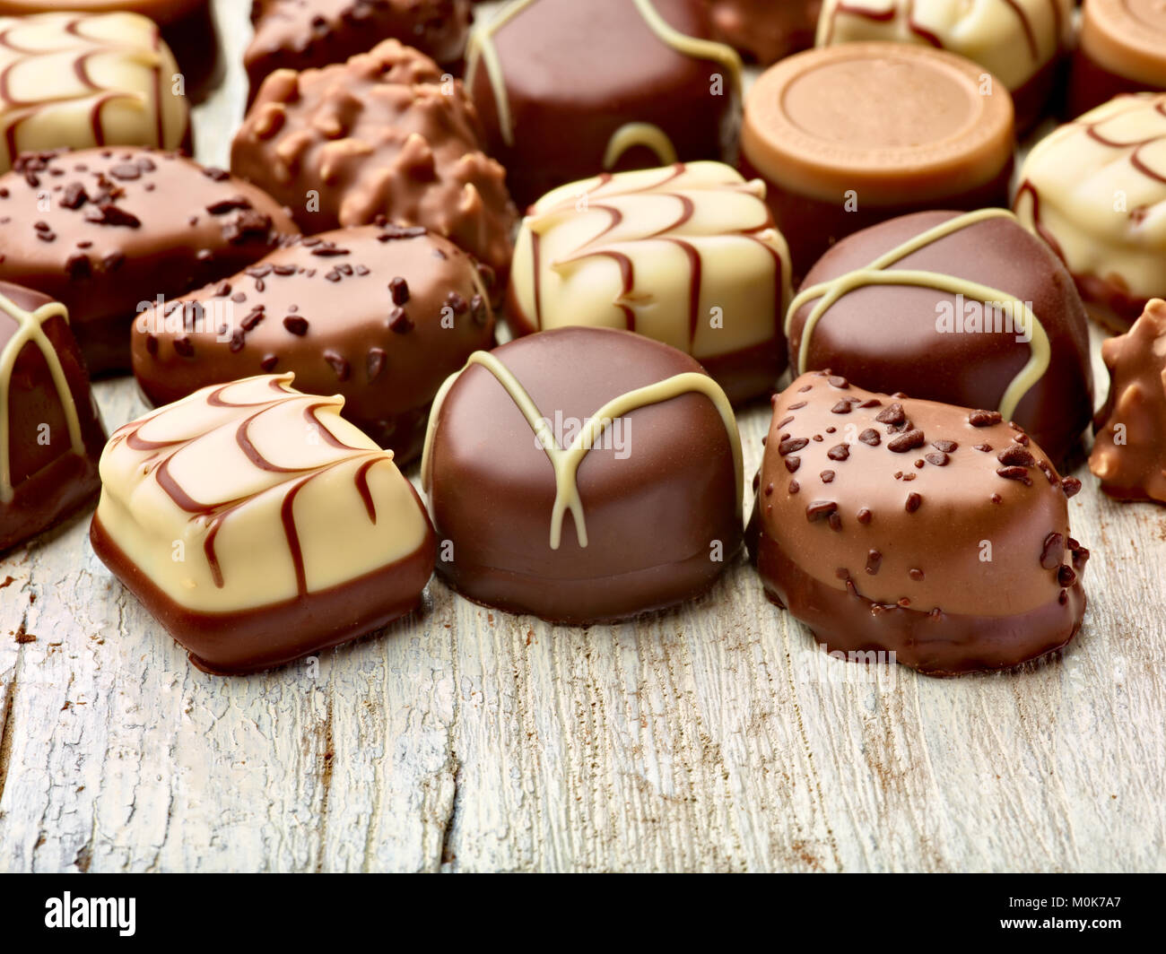 close up of chocolate praline on wooden background Stock Photo - Alamy