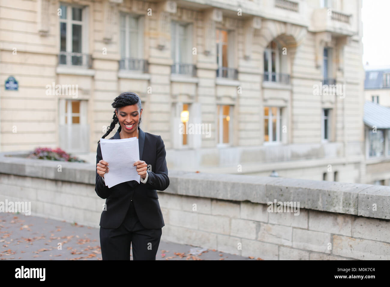 Accountant standing on street with papers in hands and talking o Stock ...