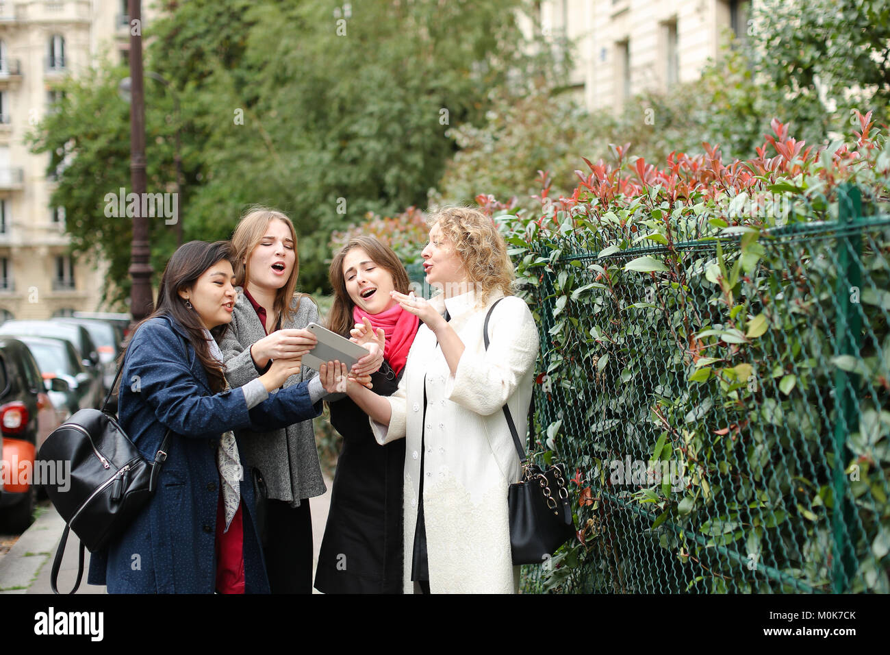 International students talking with teacher outdoors in Stock Photo - Alamy