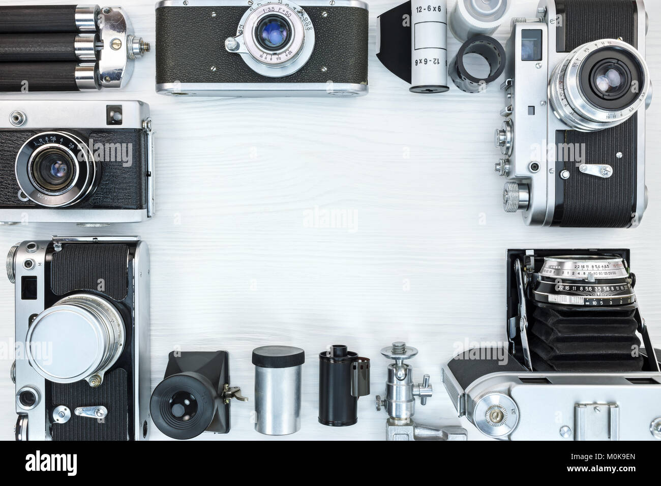 retro classic photo cameras, equipment and accessories on white wooden ...