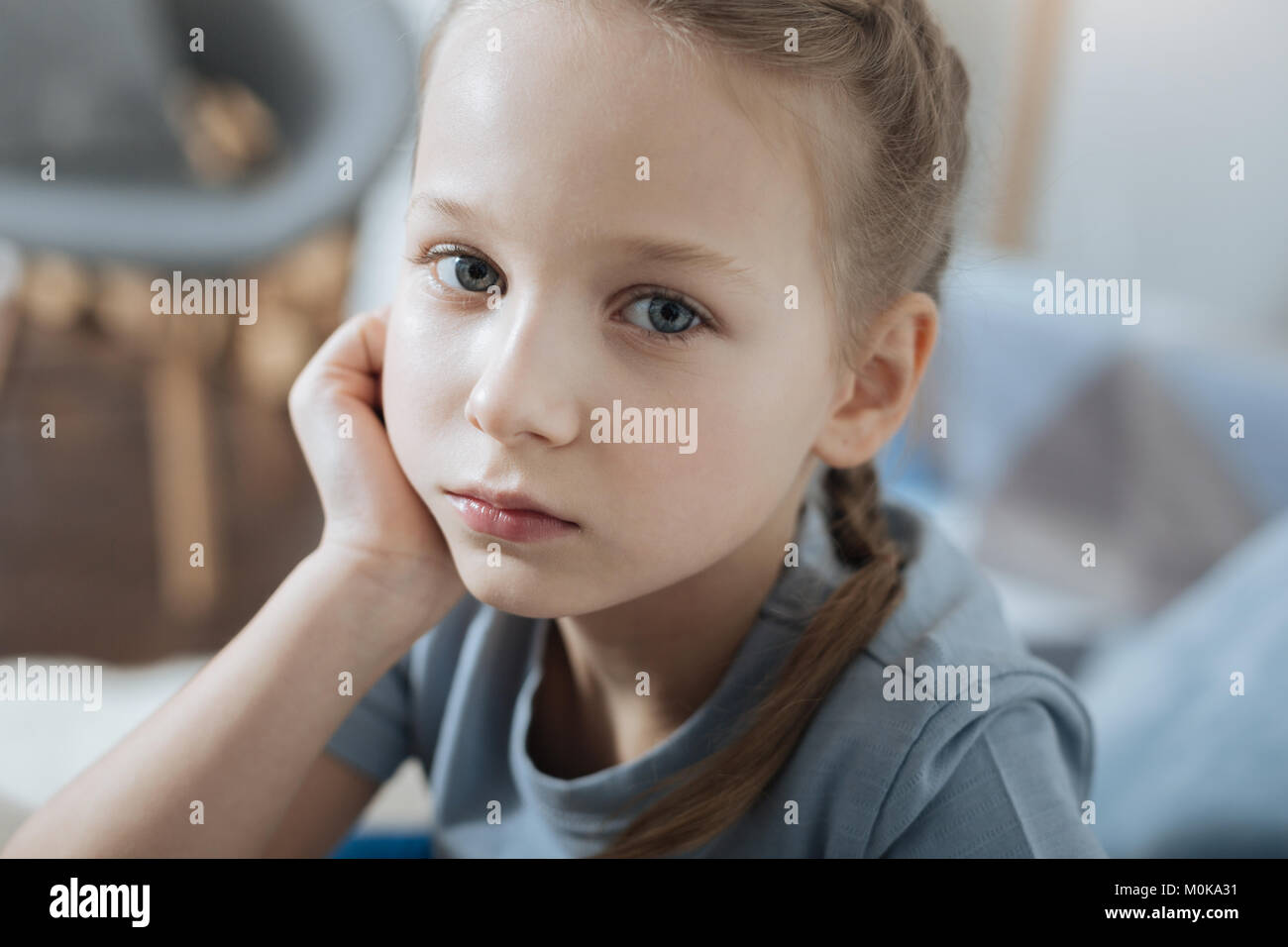 Child holding head sad hi-res stock photography and images - Alamy