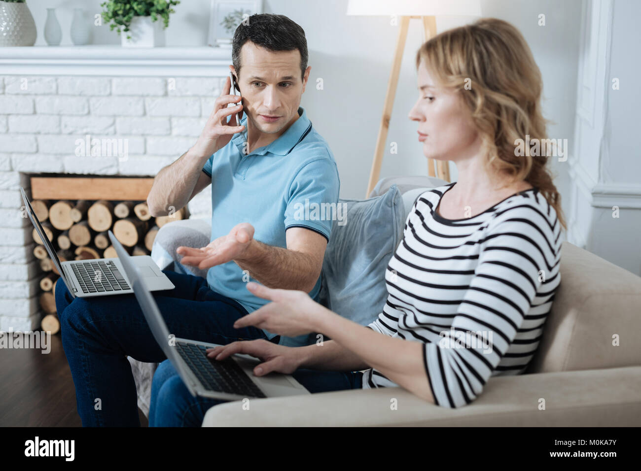 Preoccupied man busy with work Stock Photo - Alamy