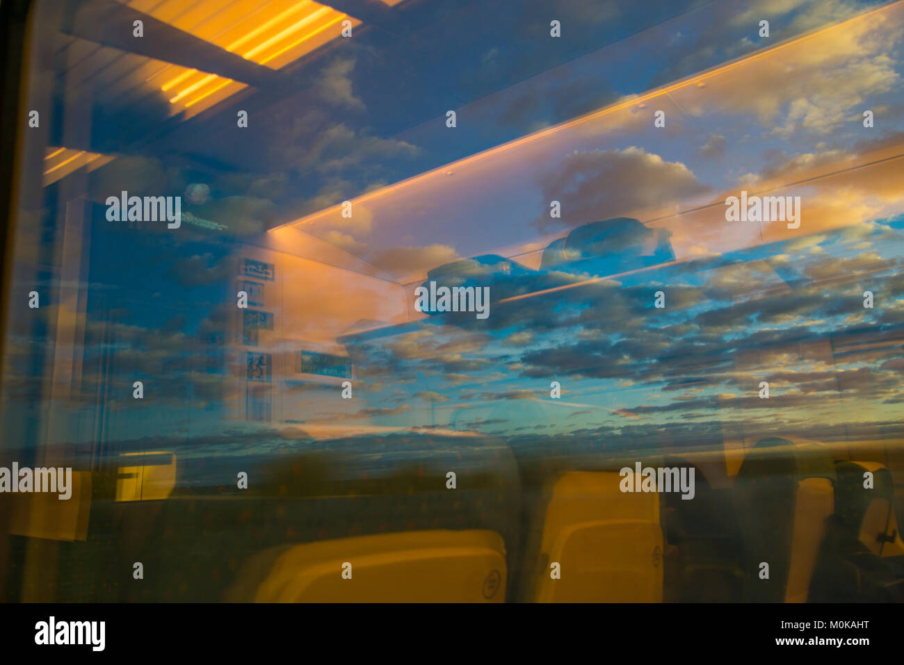 Sky reflected on train window Stock Photo - Alamy