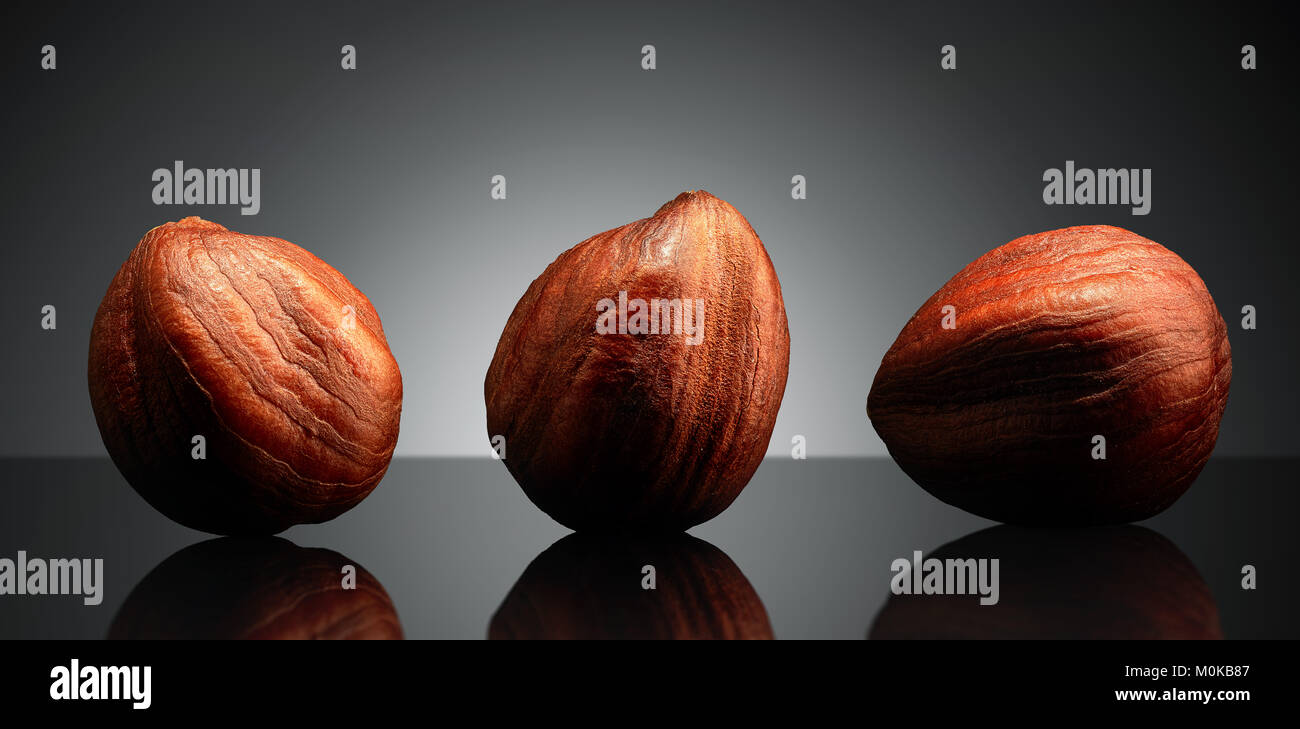 Group of hazelnut on black background. Close-up Stock Photo - Alamy