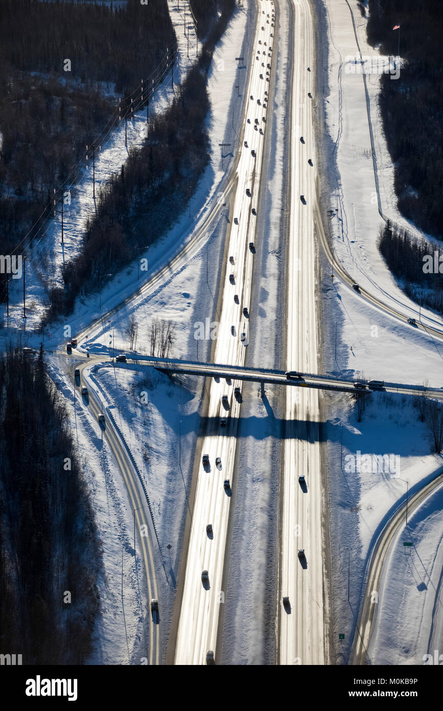 Aerial view of snow covering a highway overpass on the Glenn Highway in ...