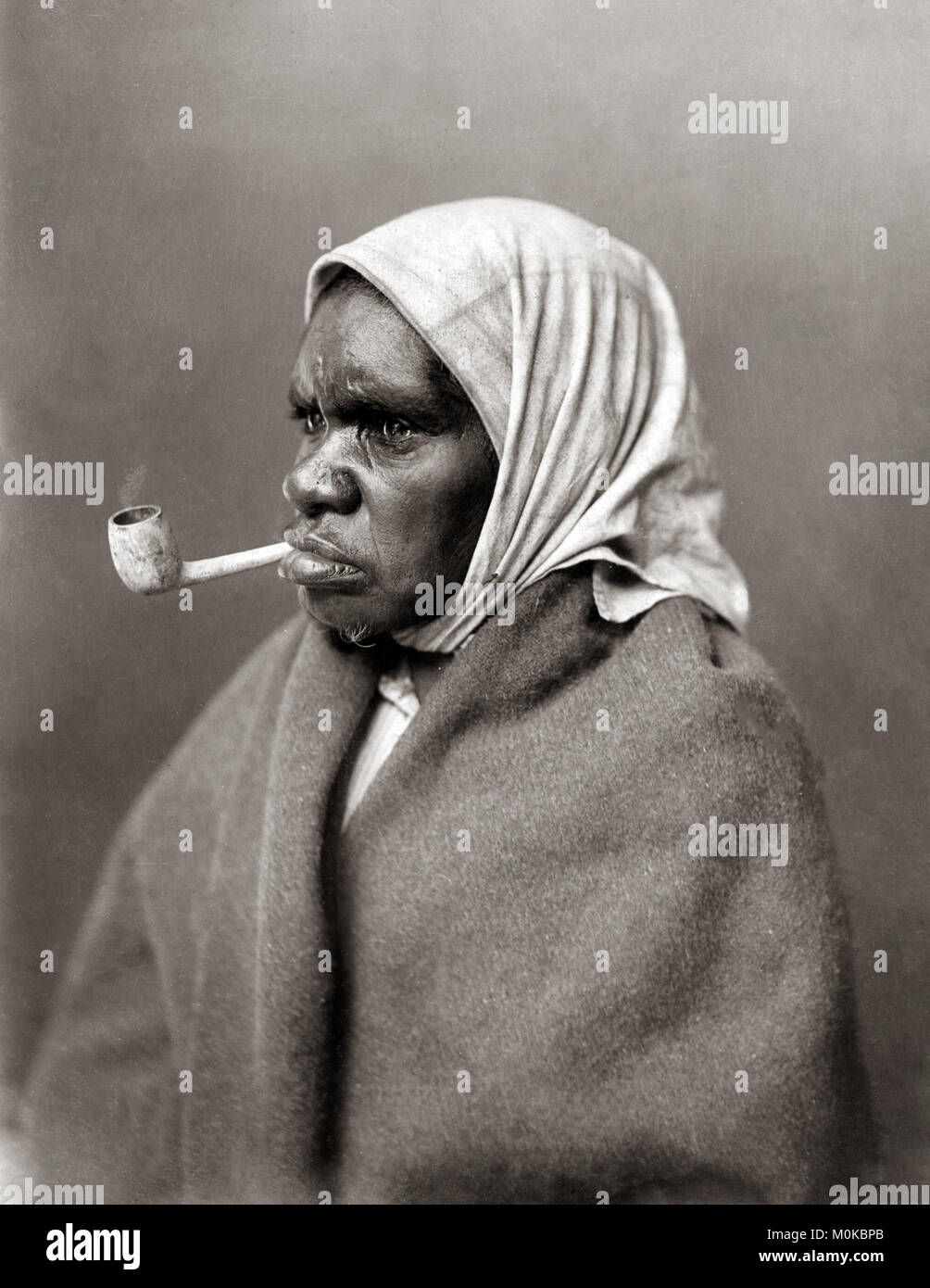 Aboriginal woman smoking a pipe, Australia, c.1890 Stock Photo - Alamy