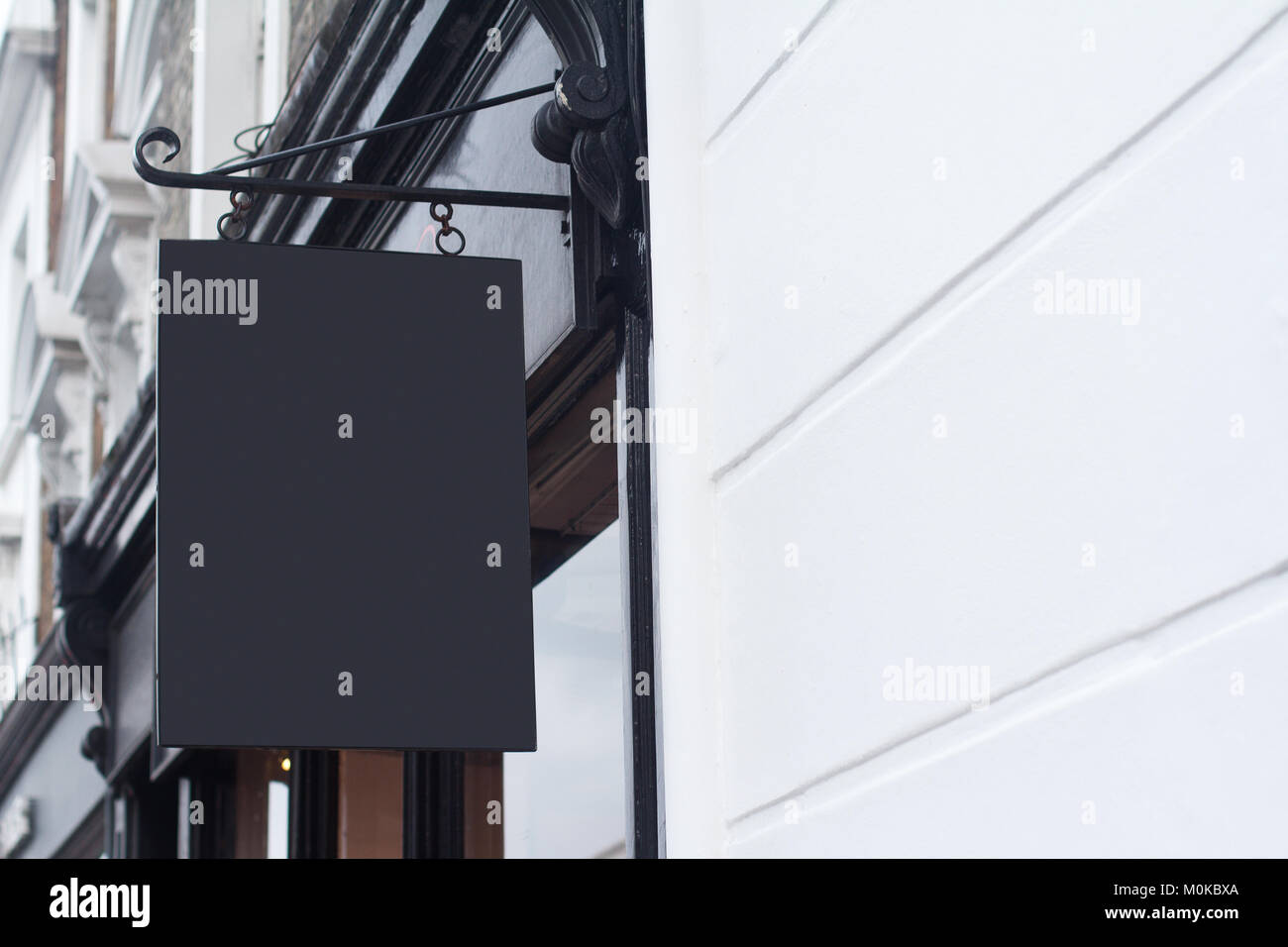 Horizontal side view of empty black square signage on a British ...