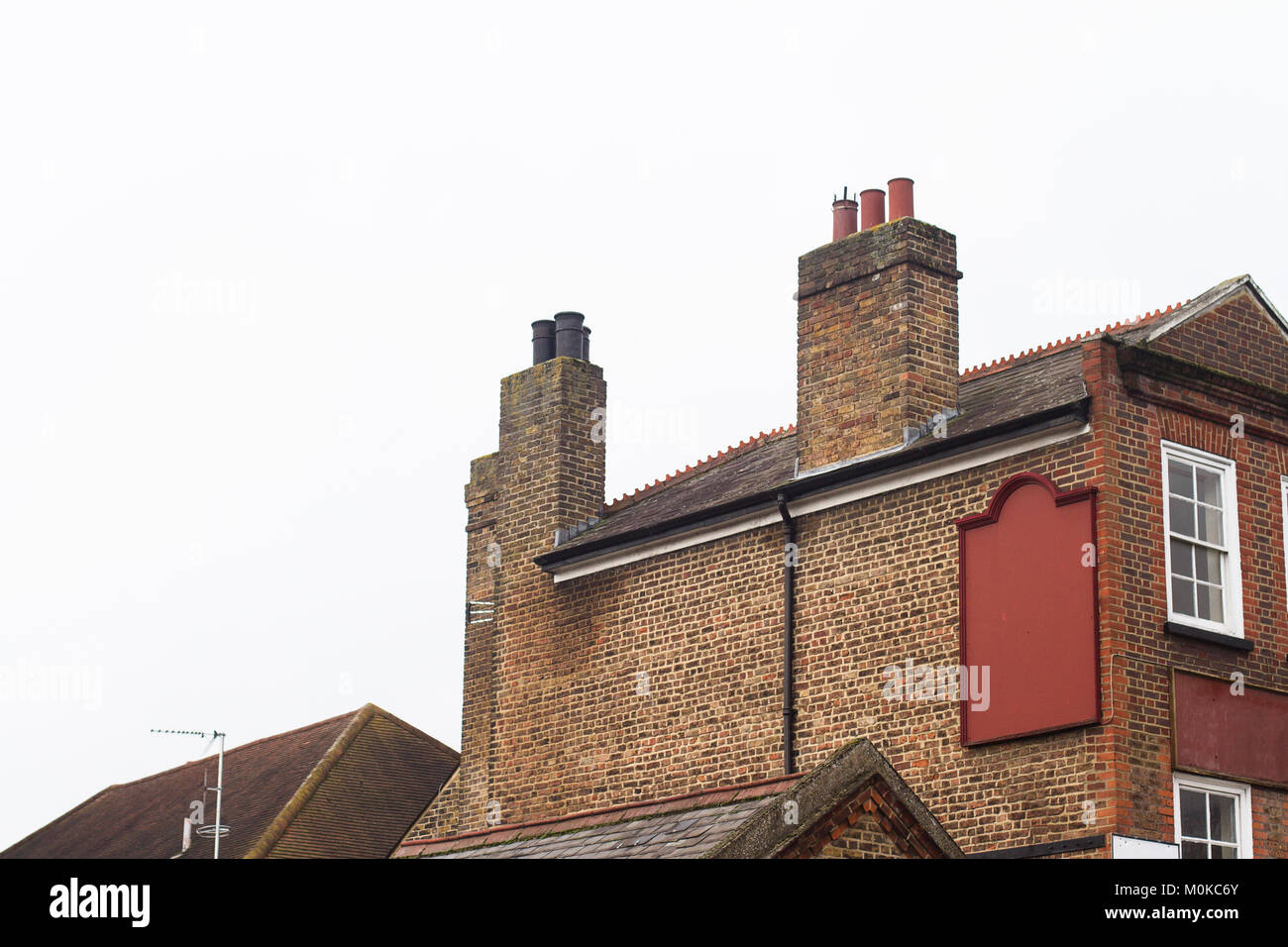 Horizontal side view of empty square signage on a brick decorated ...