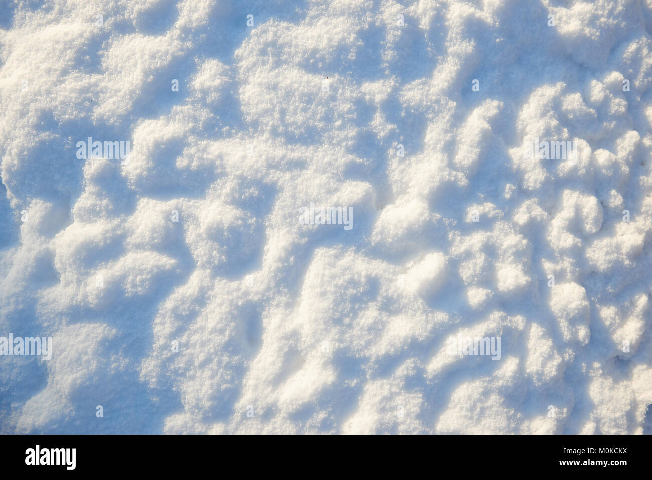 snow for texture or background at sunny day, bright light with shadows ...