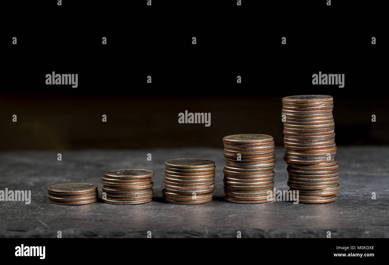 Pile of US quarters growing with compound interest Stock Photo - Alamy