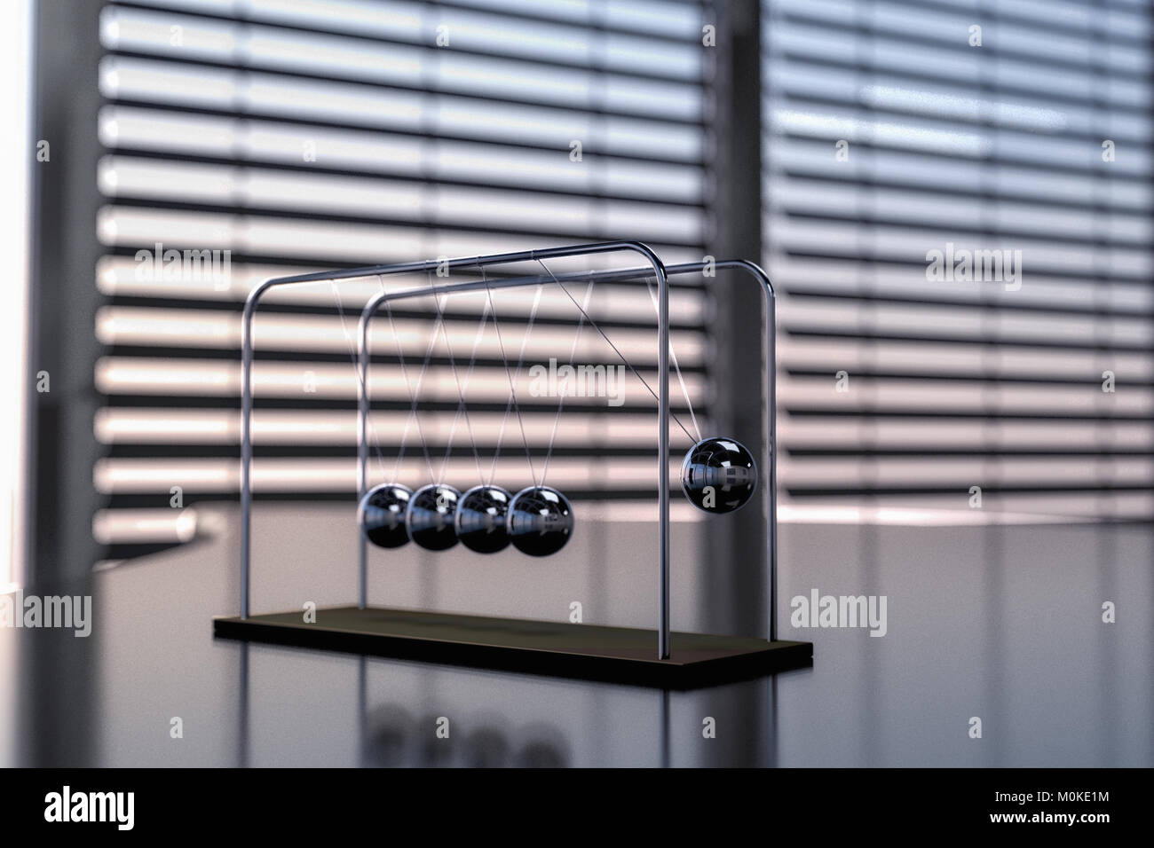 Newton's cradle pendulum Stock Photo - Alamy