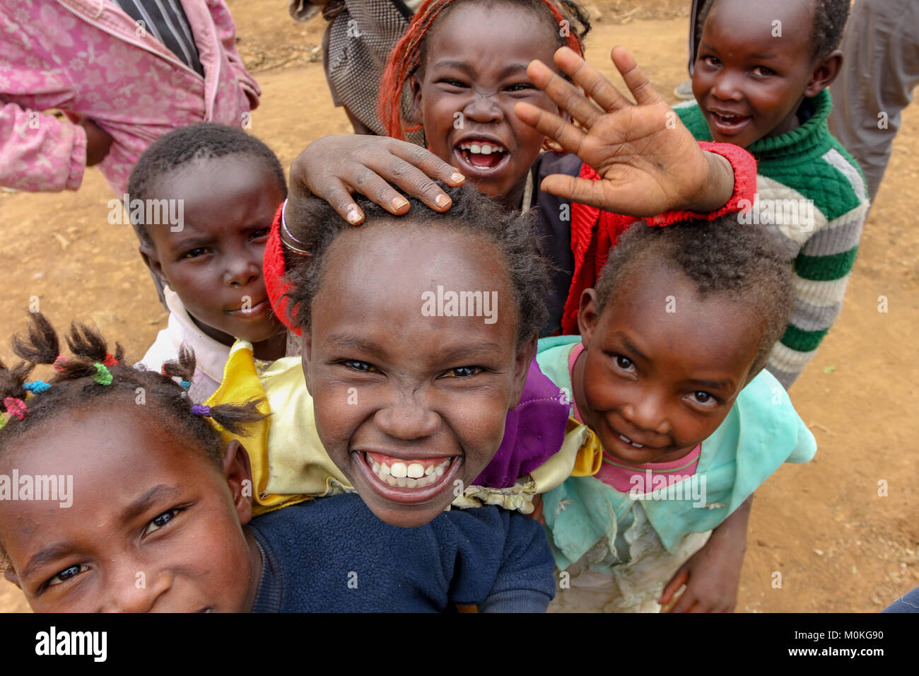 Kenyan children enthusiastically posing for camera from a village ...