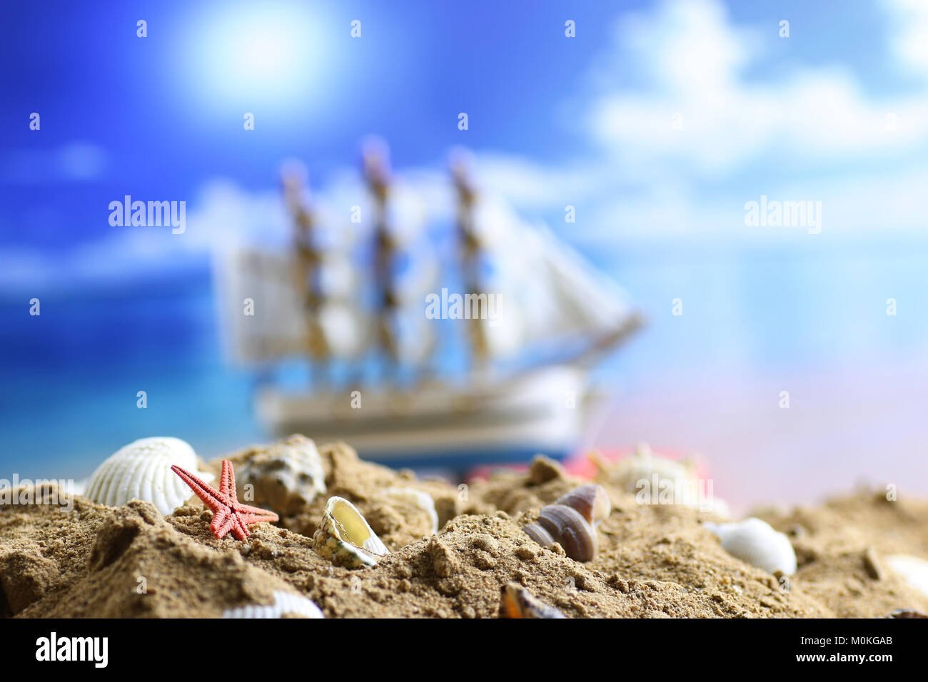 sand shell and sail in sea Stock Photo - Alamy
