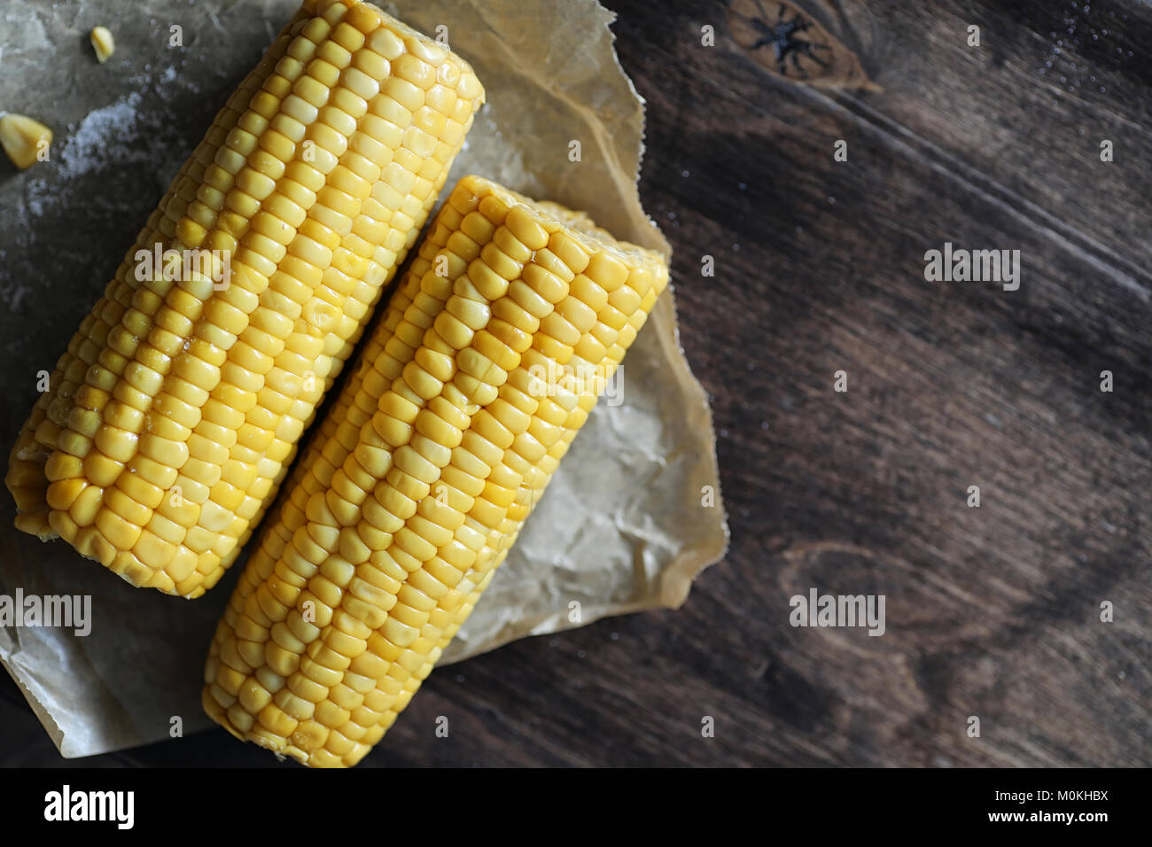 Boiled corn cob with salt on a wood Stock Photo - Alamy