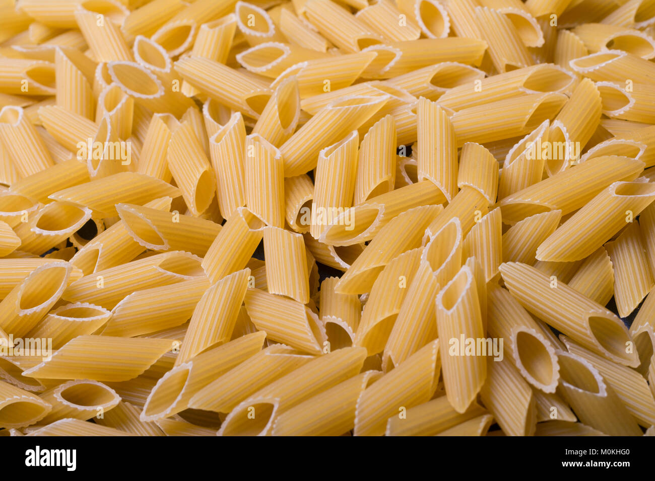 Italian penne pasta close up view. Food background texture Stock Photo ...