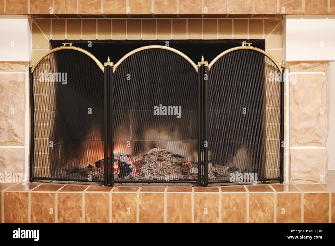 Fire burns in the home fireplace Stock Photo - Alamy