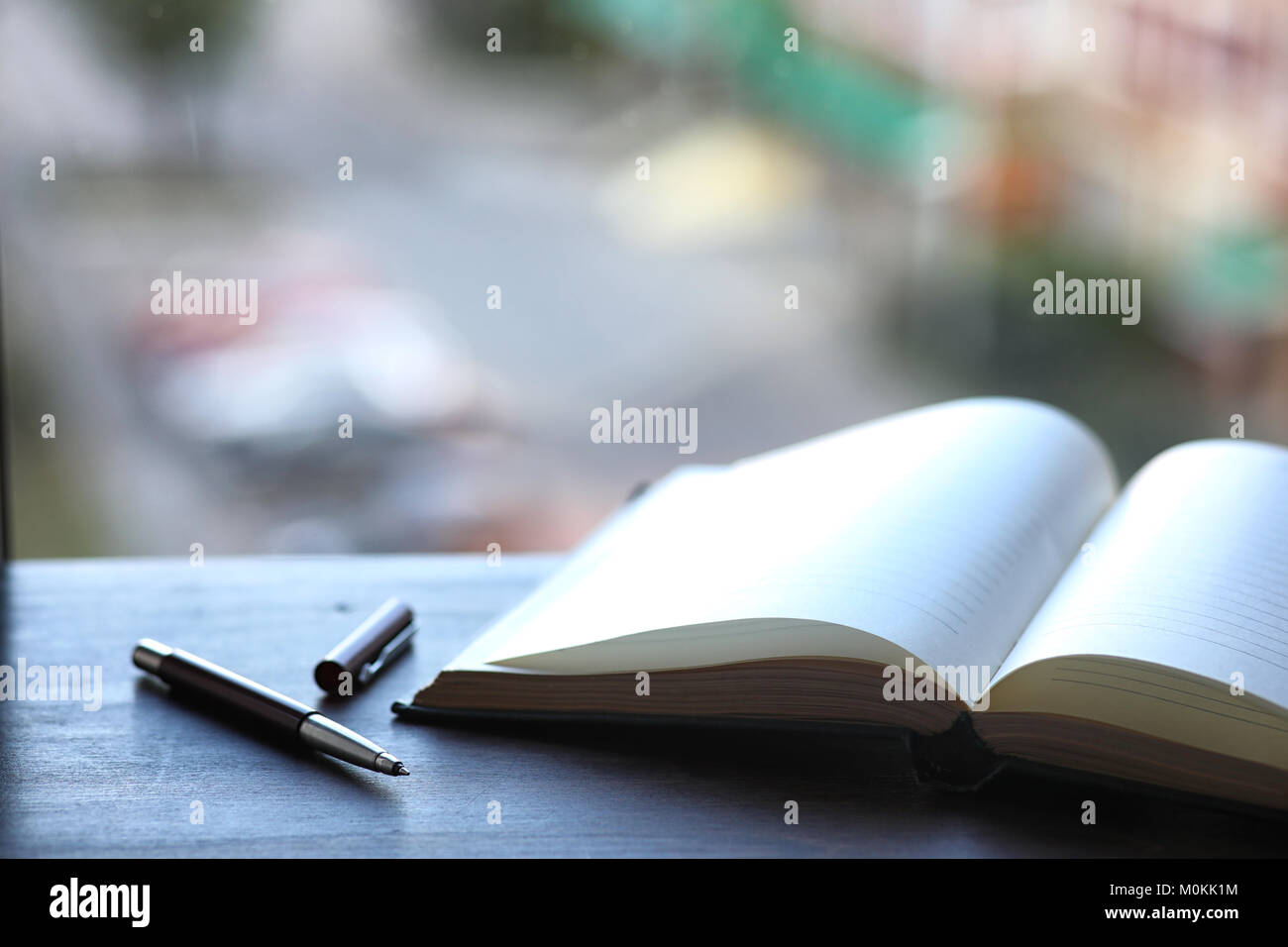 open book and a table Stock Photo - Alamy