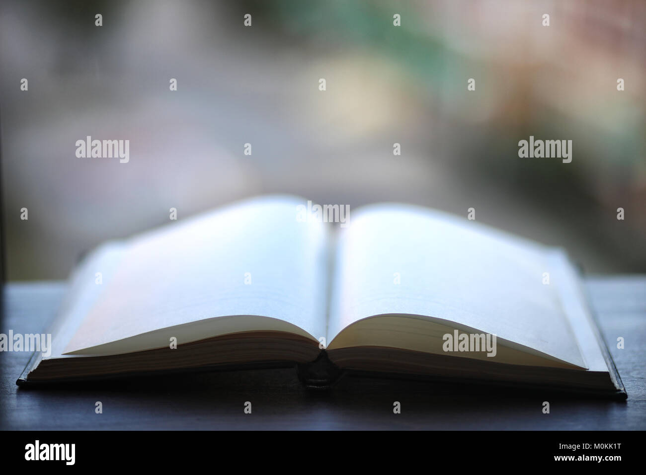 open book and a table Stock Photo - Alamy