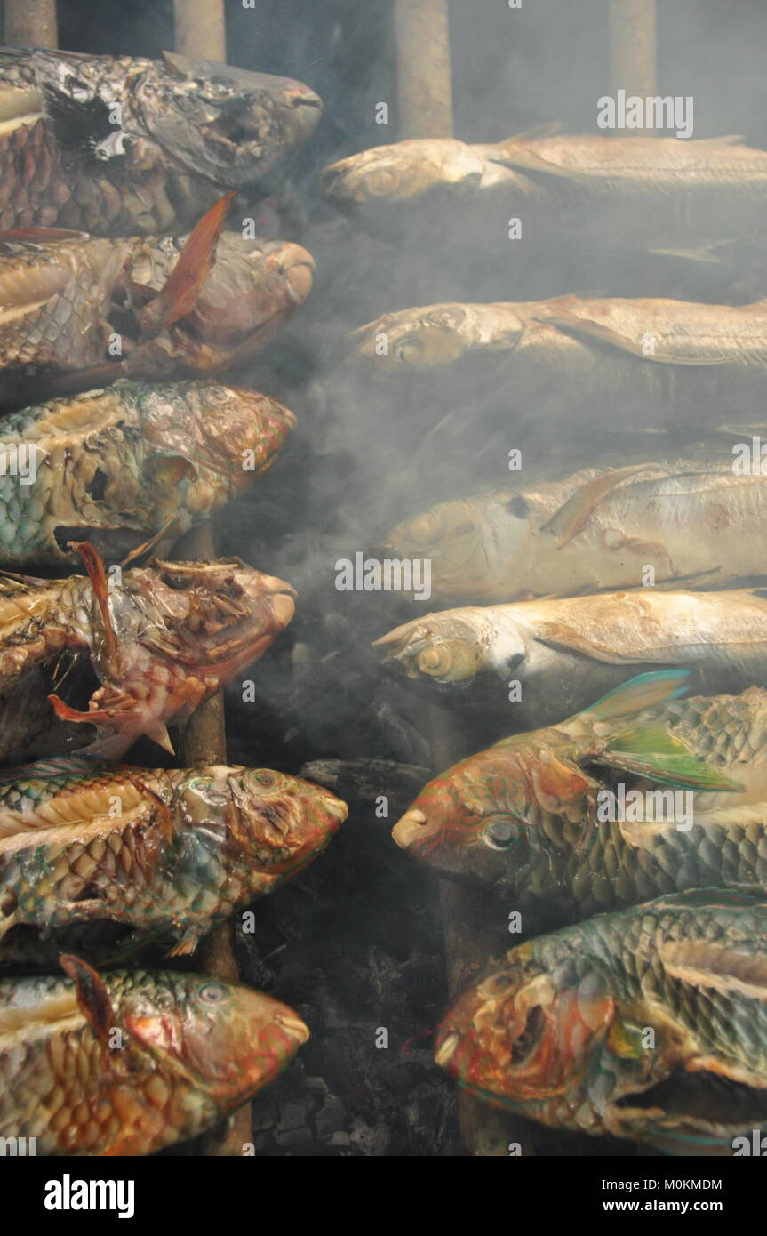 Fish of a coral reef fried on the grill. Java in Indonesia Stock Photo ...