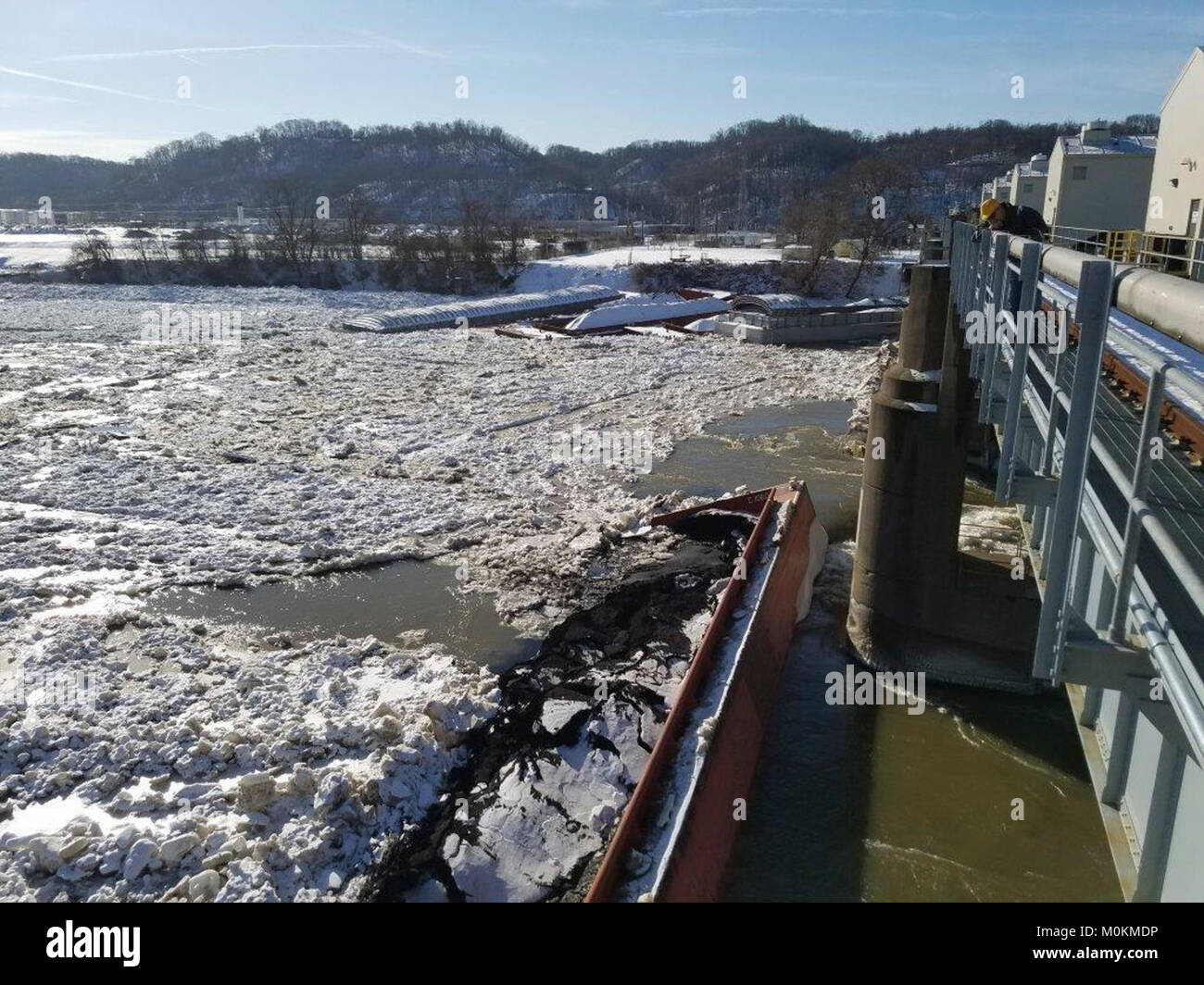 A member of the unified command surveys the breakaway barges at ...