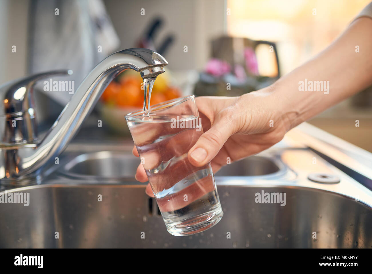 Filling glass tap water hand hi-res stock photography and images - Alamy