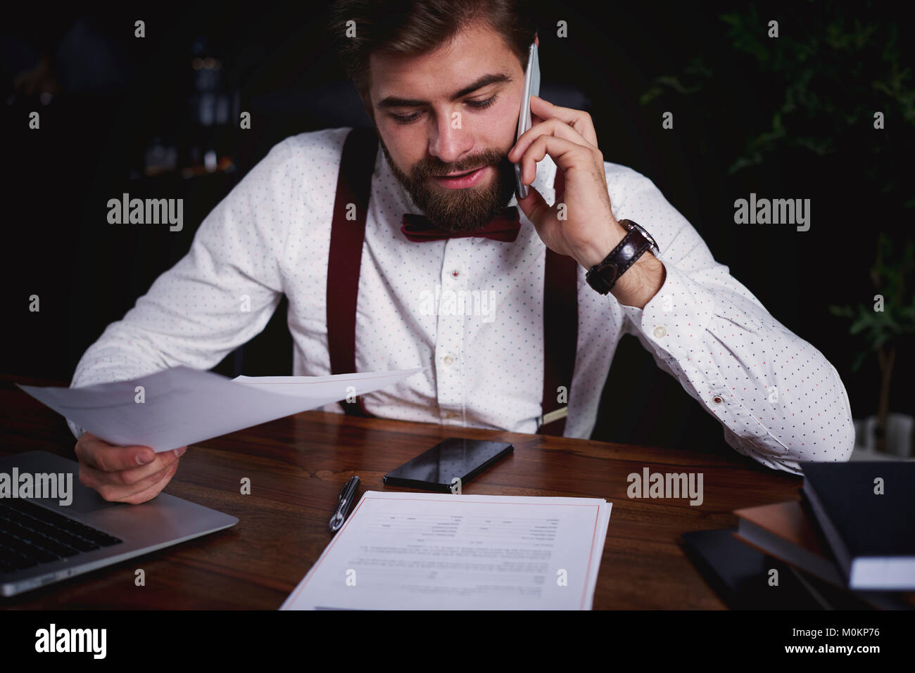 Man working at his desk Stock Photo - Alamy