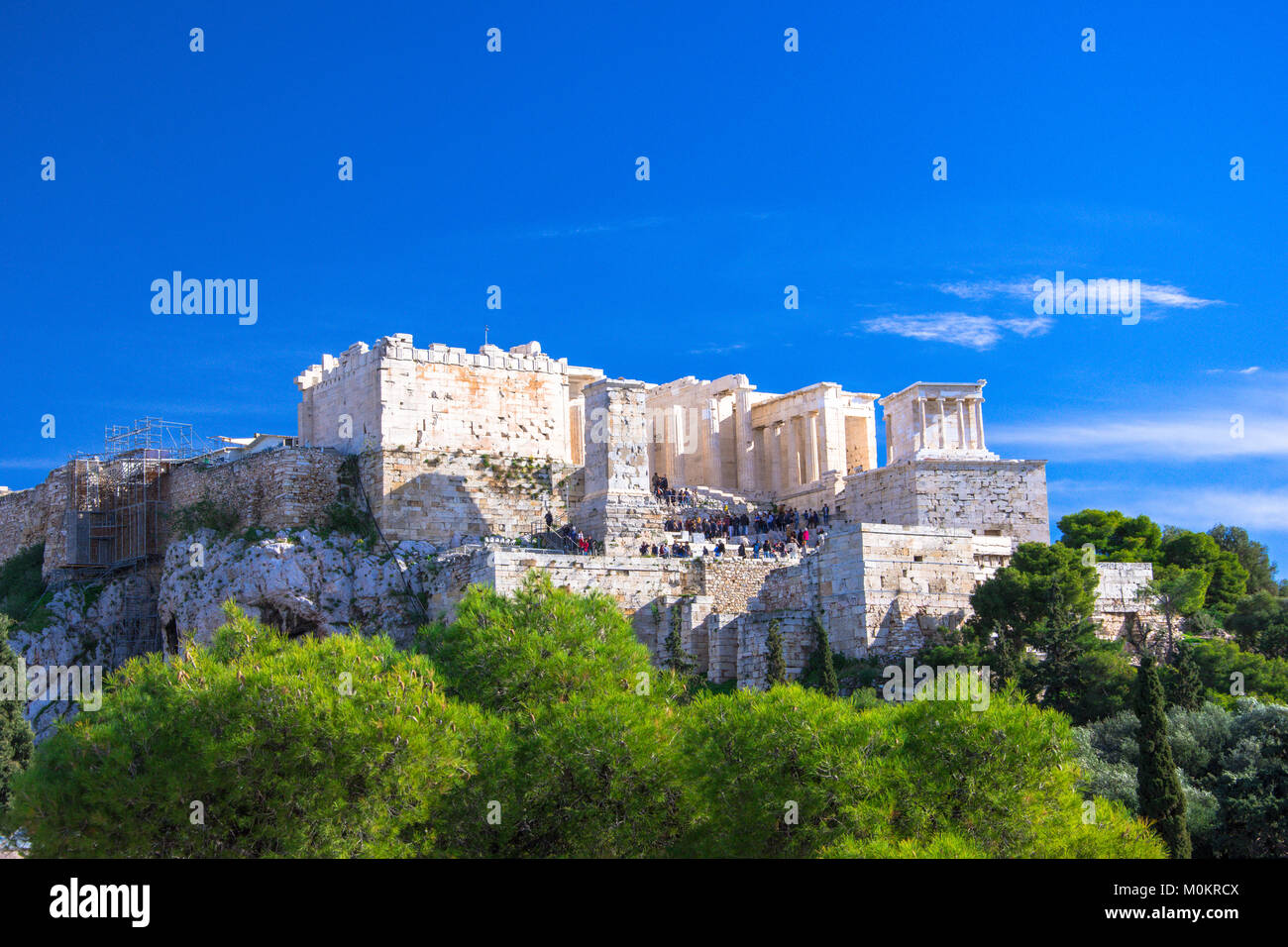 Acropolis with Parthenon. View through a frame of green plants, trees ...