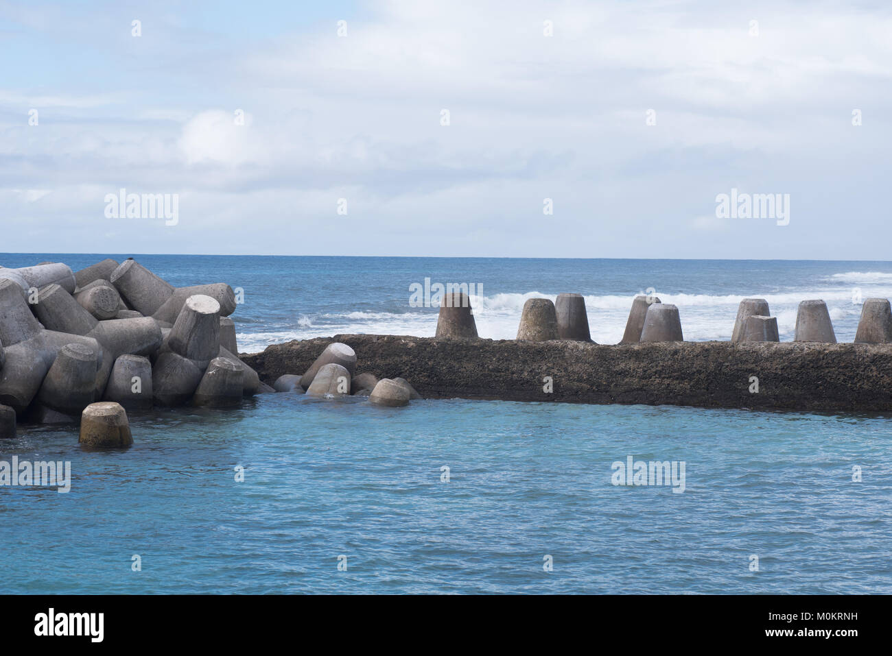 Breakwater blocks at the waterfront for waves protection Stock Photo ...