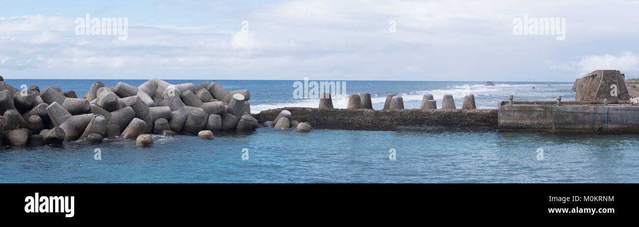 Breakwater blocks at the waterfront for waves protection Stock Photo ...
