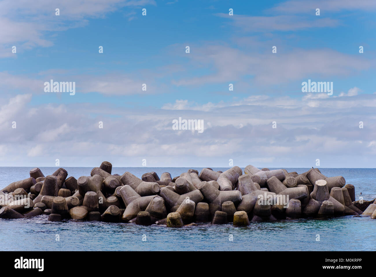 Breakwater blocks at the waterfront for waves protection Stock Photo ...
