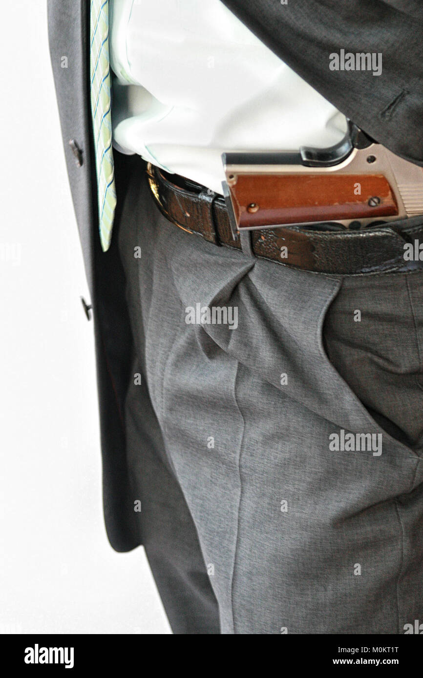 Security personnel armed with a pistol Stock Photo - Alamy