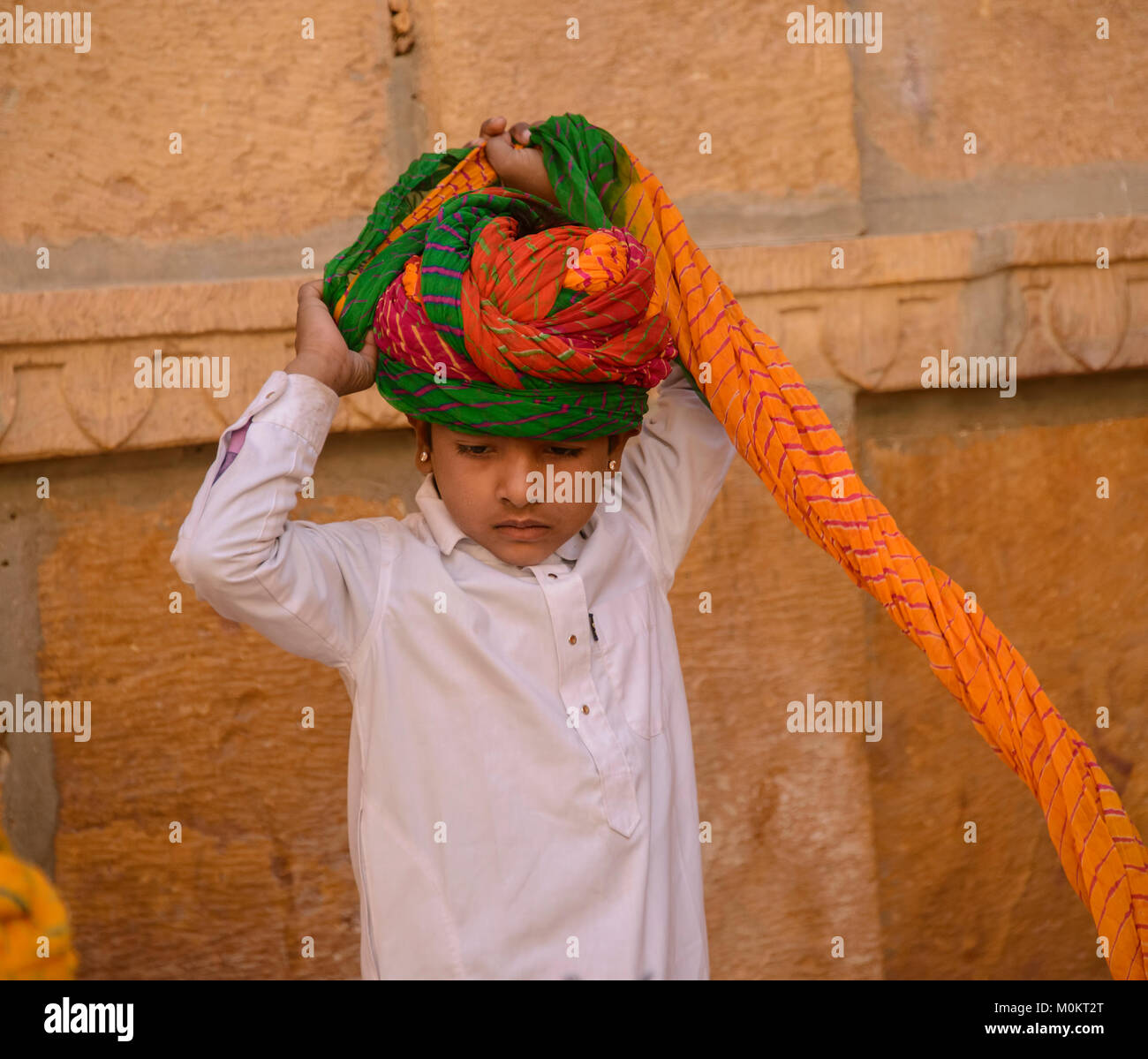 A boy putting on turbans, Jaisalmer, Rajasthan, India Stock Photo - Alamy